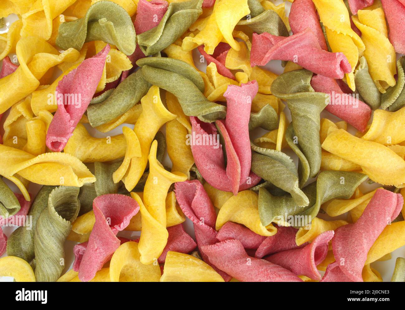Full frame of colorful campanelle pasta isolated on white background ...