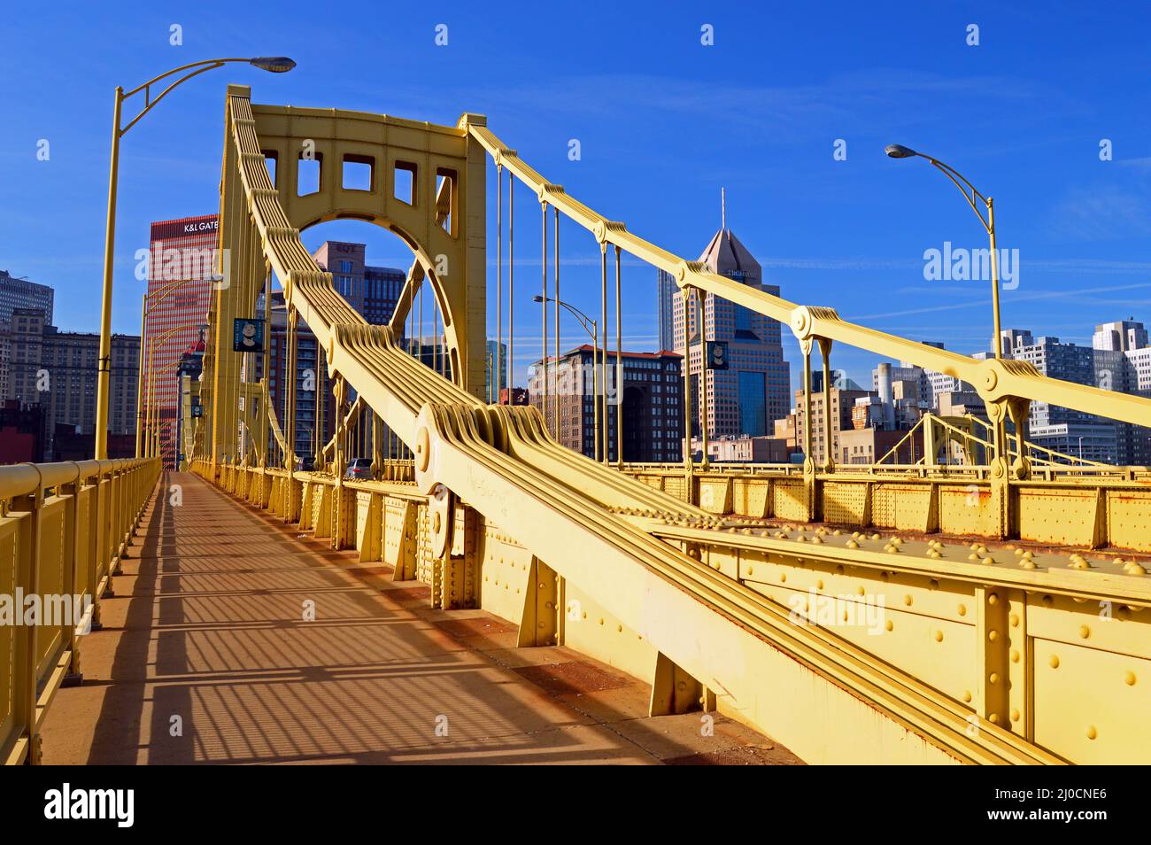 The yellow Sixth Street Bridge leads pedestrians and drivers to ...