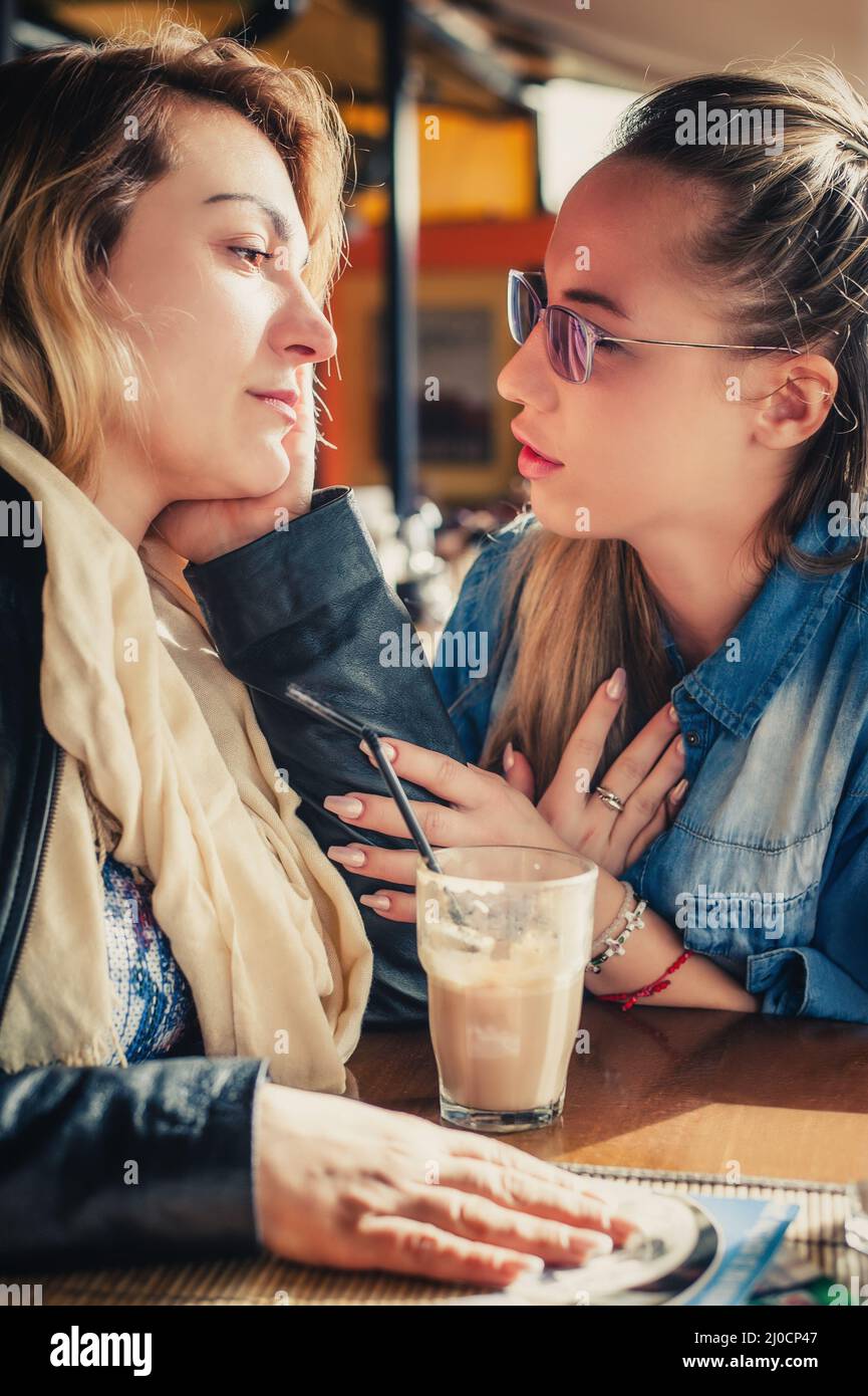 Two women talking serious comforting hi-res stock photography and ...