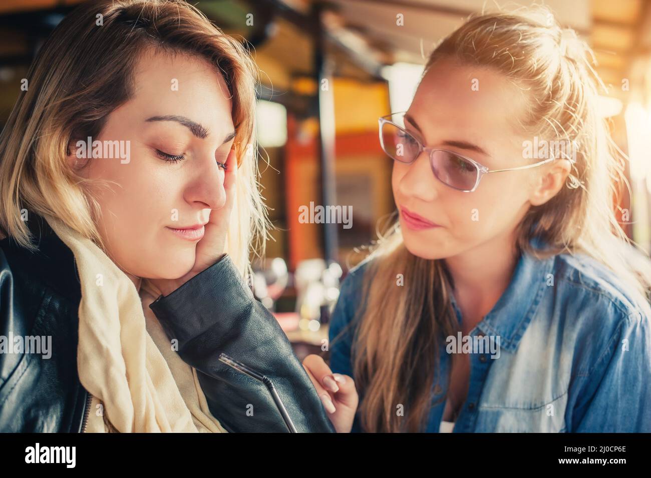 Two women talking sad hi-res stock photography and images - Alamy