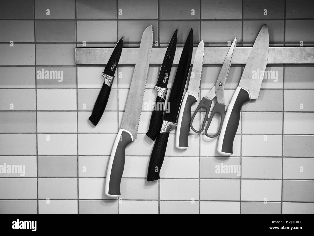 Hanging knives and scissors Stock Photo - Alamy