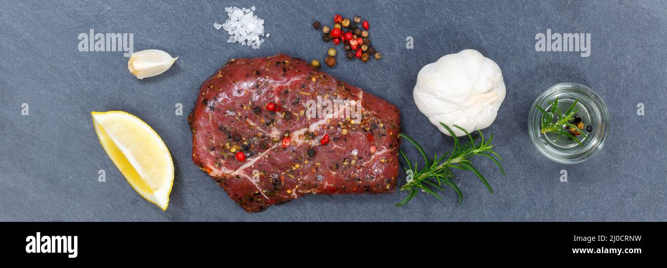 Meat steak raw beef banner from top slate Stock Photo - Alamy
