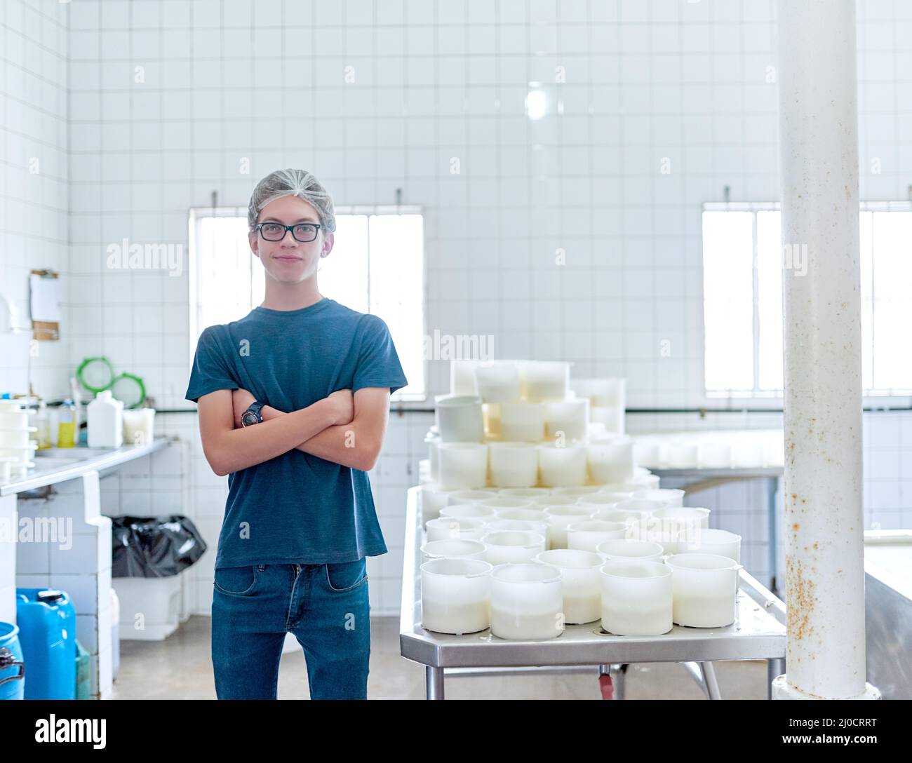 Im in the business of producing cheese. Cropped shot of a man working ...