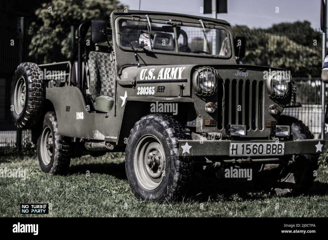 Closeup of typical vintage US army SUV car Jeep Willys in grayscale ...