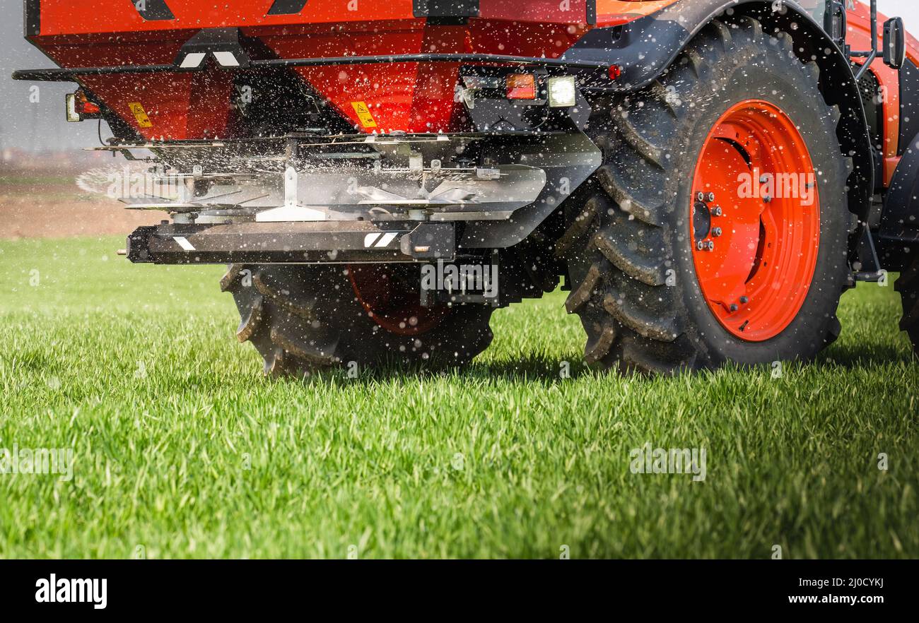 Tractor spreading artificial fertilizers. Transport, agricultural Stock ...