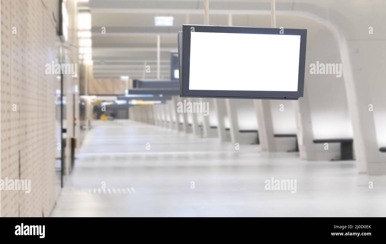 Digital signage display with a white screen hanging on a ceiling in the ...