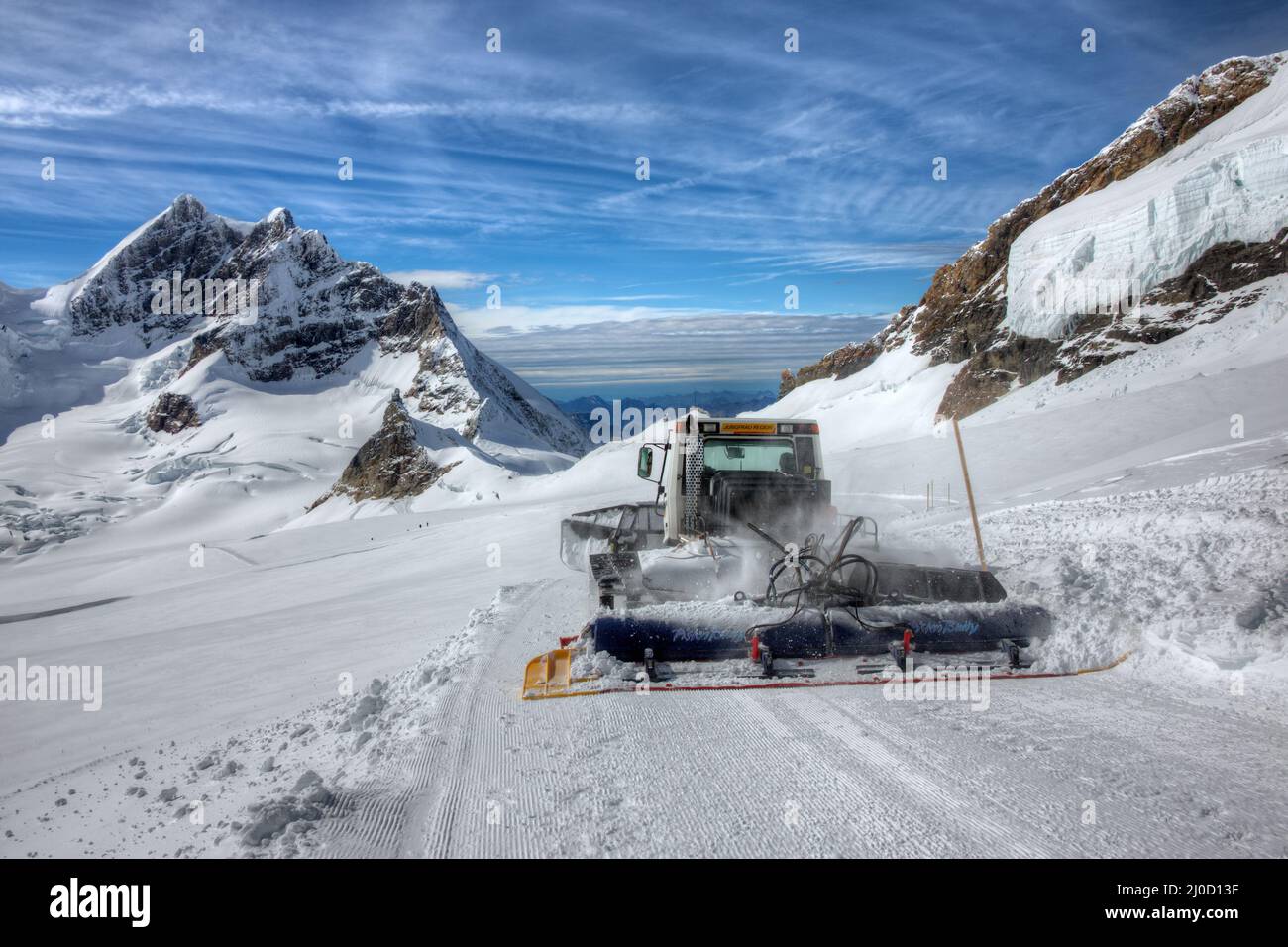 Snowplow - snow piste Stock Photo - Alamy