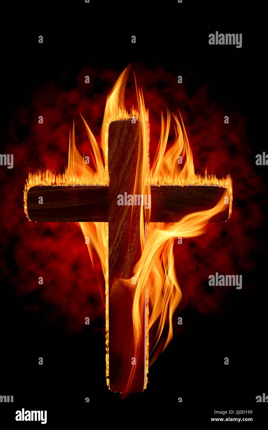 Cross burning or lighting concept theme with a wooden crucifix engulfed ...