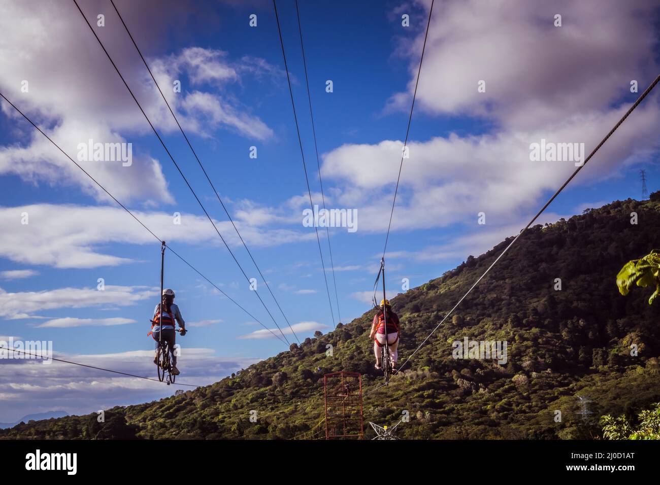 Riding a bike on a zip line on a nice day in El Salvador. Cycling ...