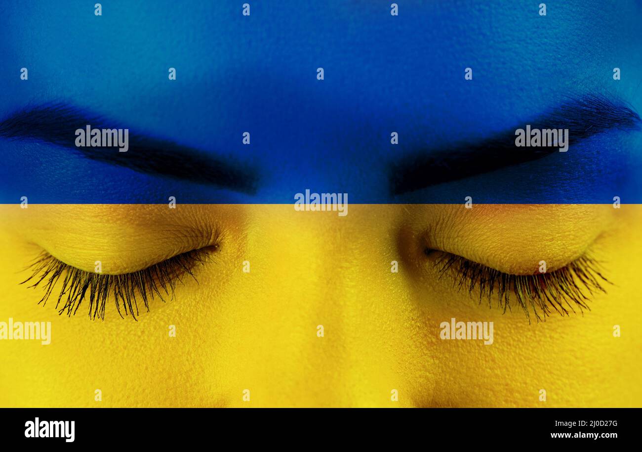 Woman face in ukraine flag colors. Ukraine flag painted over female ...