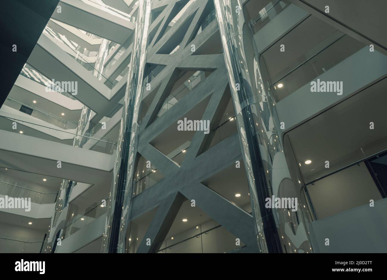 View from below of interior metal and glass structure of an empty ...