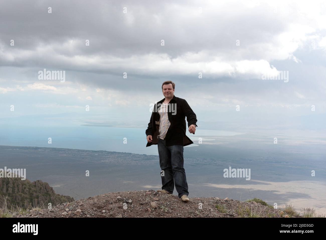 The man on Issyk Kul background, Kyrgyzstan Stock Photo - Alamy