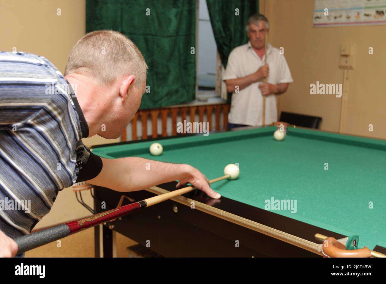 Two men plays in a billiards game Stock Photo - Alamy