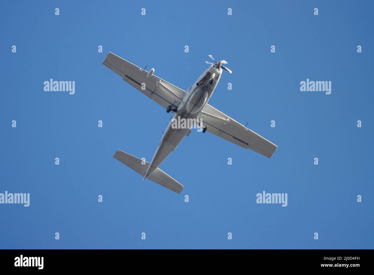 a close up of a propeller plane in the blue sky Stock Photo - Alamy