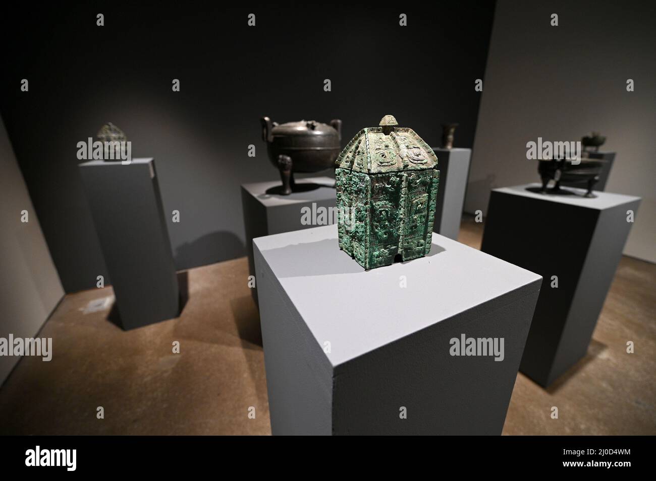 A person walks towards Indian artist Bhupen Khakhar’s “Sheikh Shoe Mart ...