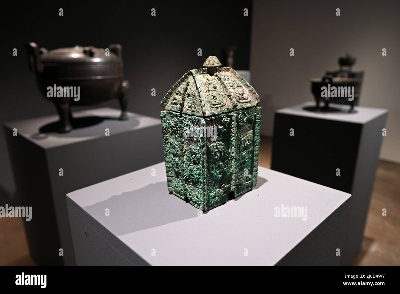 A person walks towards Indian artist Bhupen Khakhar’s “Sheikh Shoe Mart ...