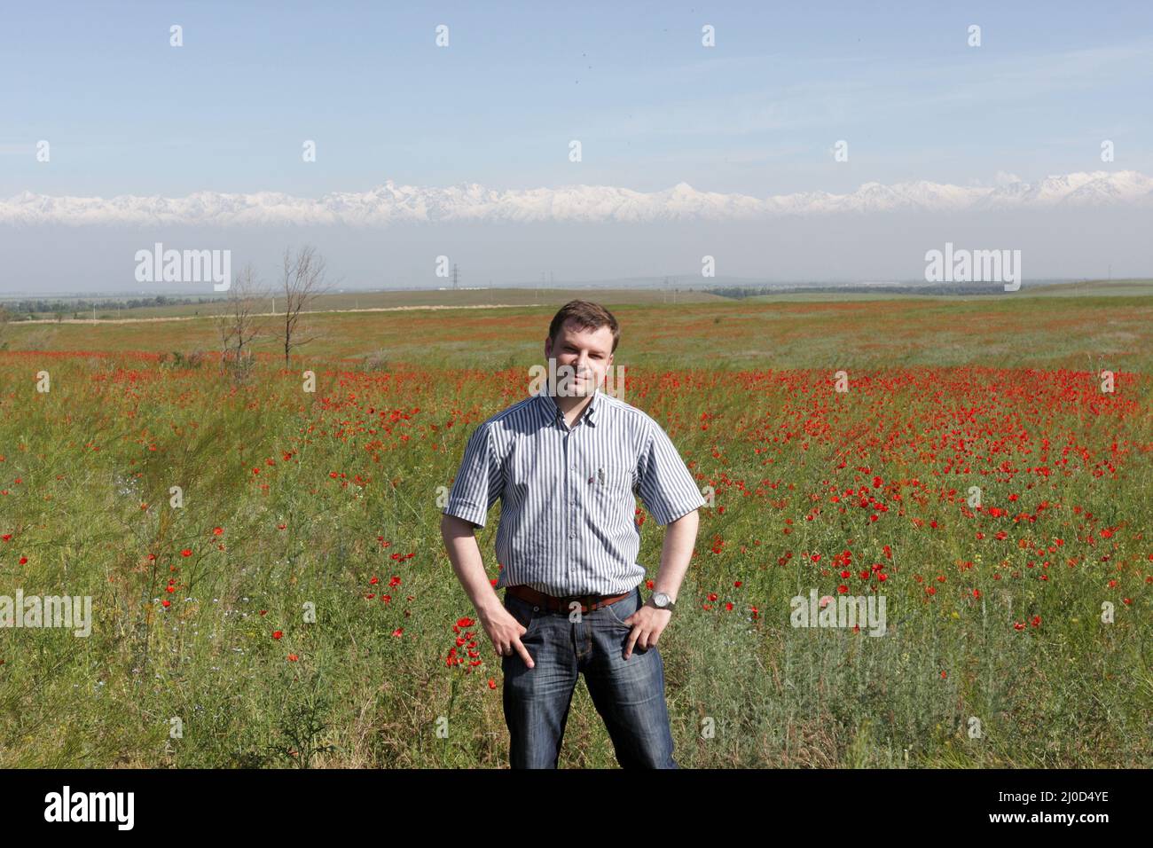 The tourist poses on steppe background in Kazakhstan Stock Photo - Alamy