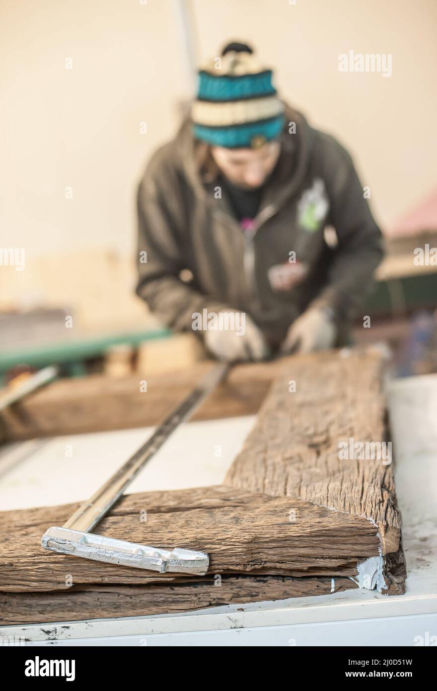 Construction Worker Using Tape Measure. Professional carpenter at work ...