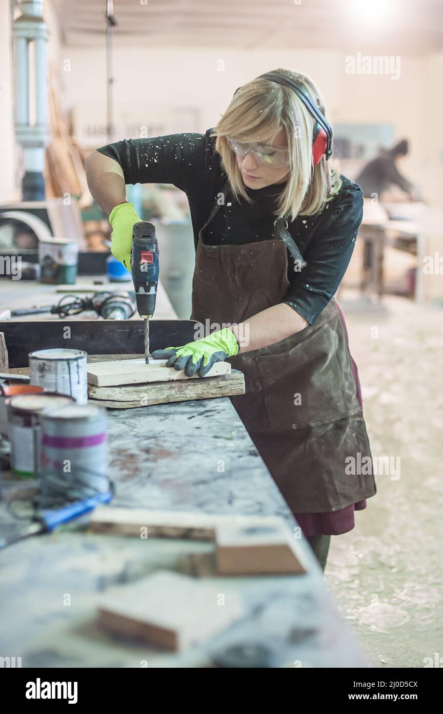 Female handyman drill hi-res stock photography and images - Alamy