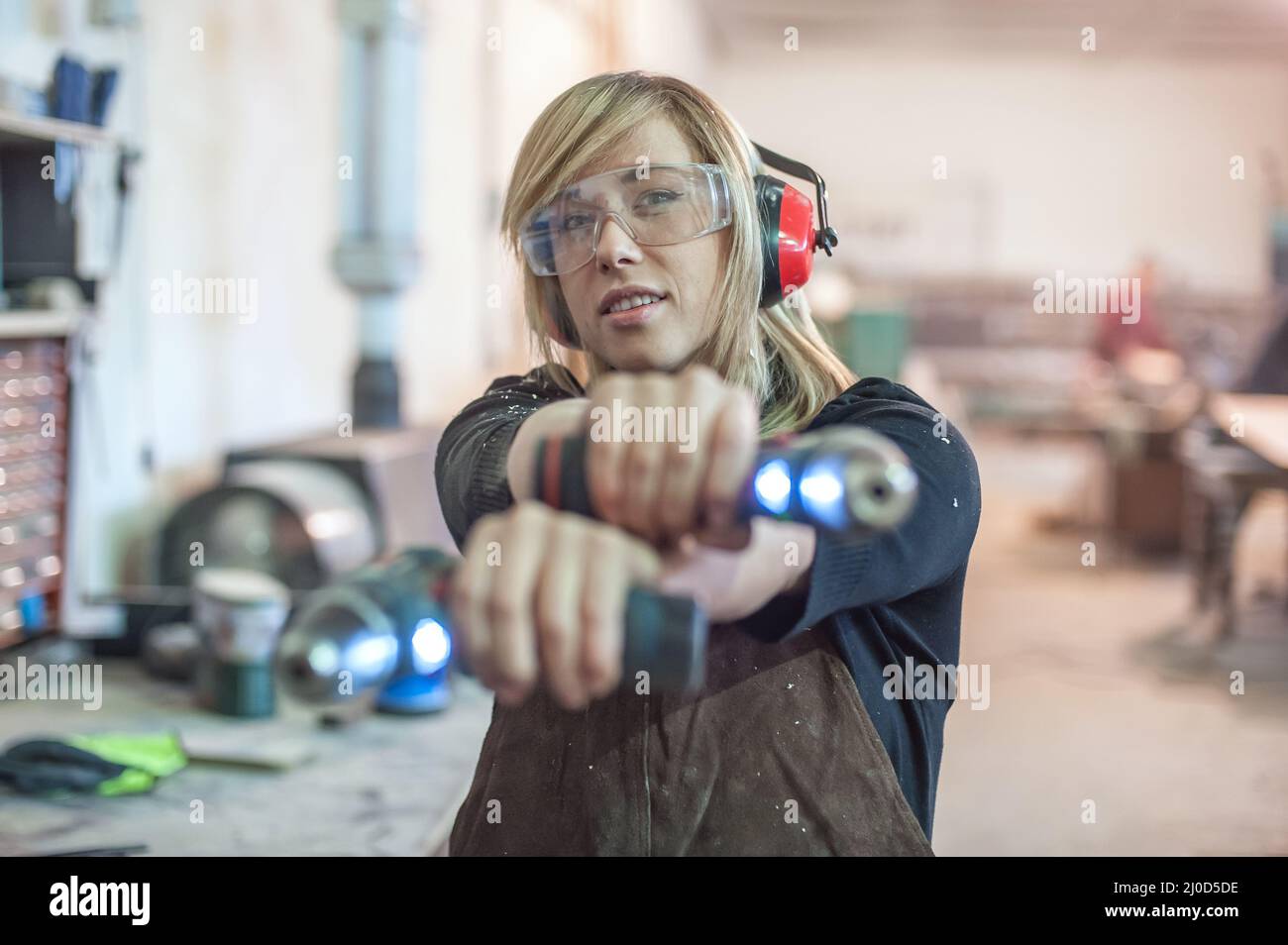 Female handyman drill hi-res stock photography and images - Alamy