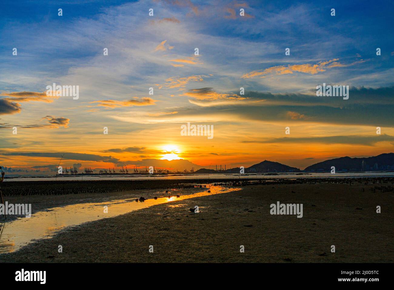 sunset over Deep Bay on the beach in Hong Kong Pak Nai Stock Photo - Alamy