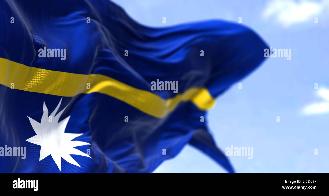 Detail of the national flag of Nauru waving in the wind on a clear day ...