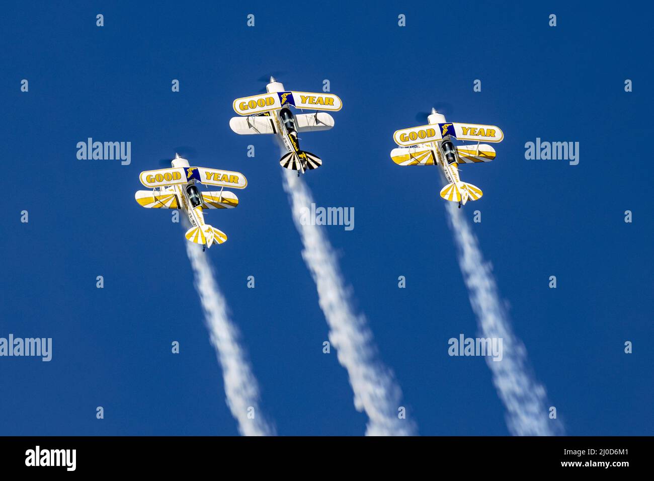 Low angle shot of biplanes doing stunts in a blue sky over Nelspruit ...