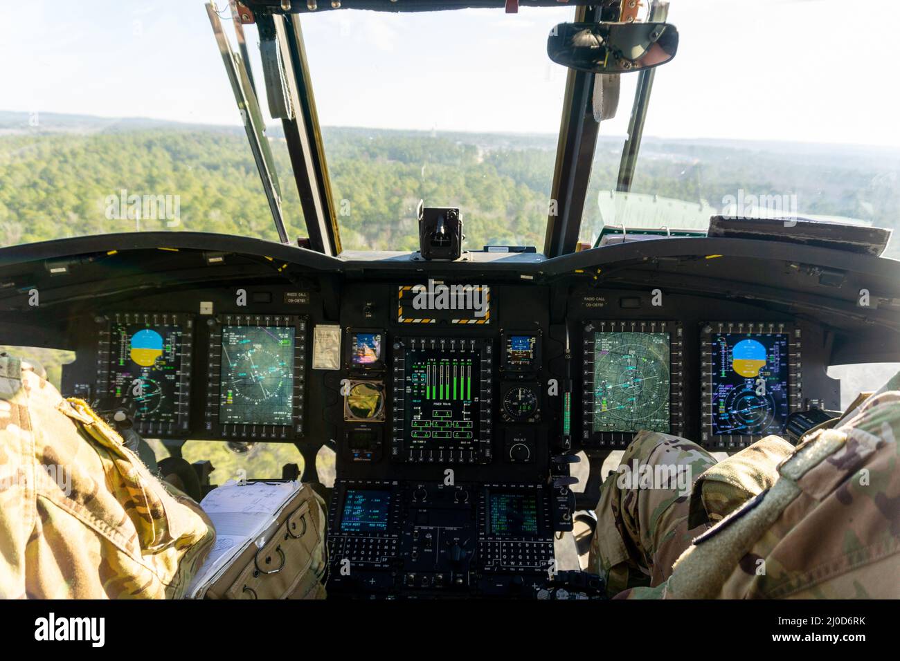 The dashboard and green forested vew from US Army Chinook CH47 ...