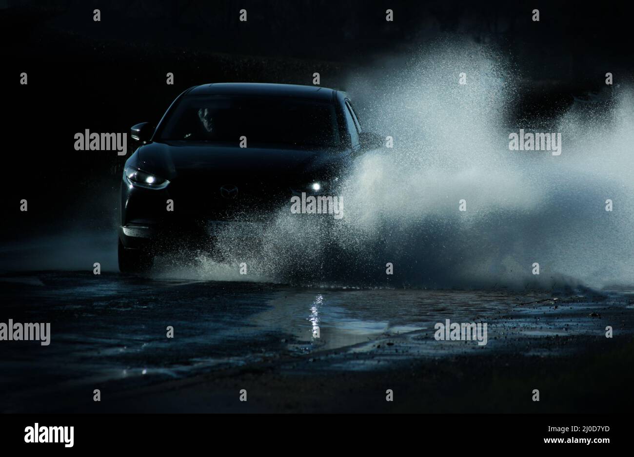 Car driving through floodwater hi-res stock photography and images - Alamy