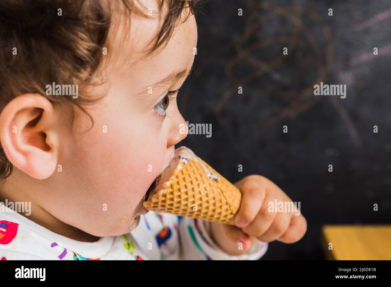 A baby eating a ice cream Stock Photo - Alamy