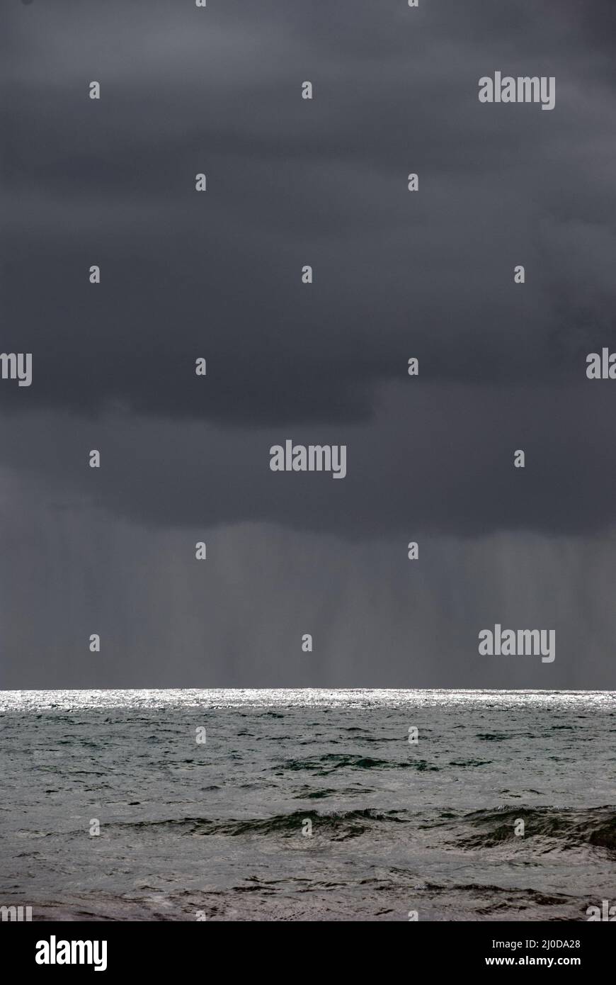 UK, English Channel. Rain or storm approaching over the sea with a band ...
