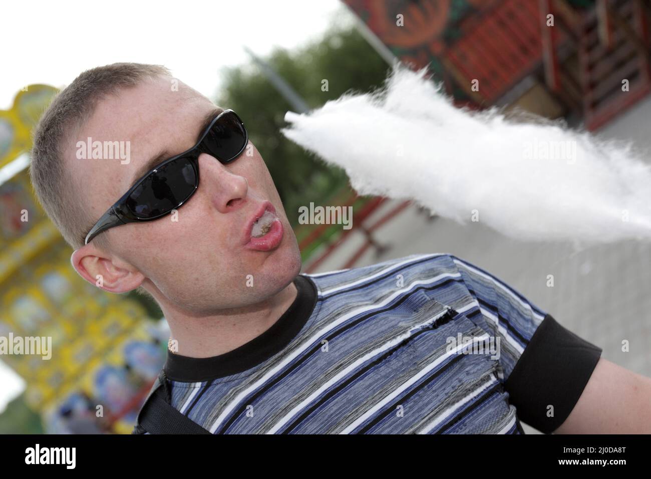 The hungry man with candy floss, outdoor Stock Photo - Alamy