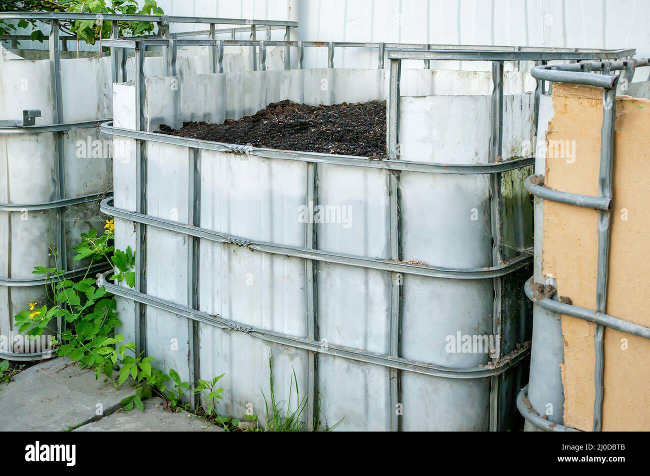 device for making compost in a public vegetable garden. garbage is ...