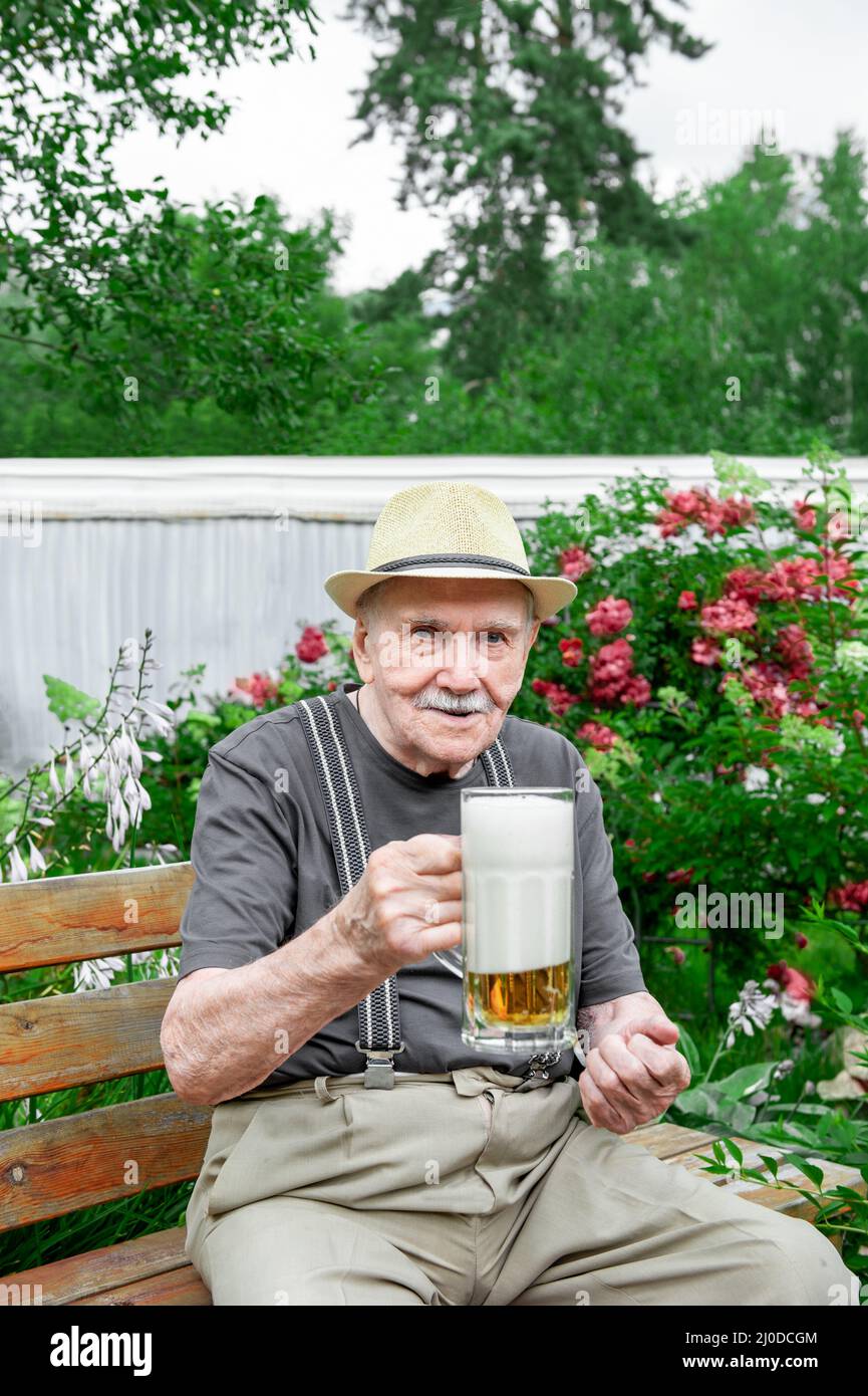old man with a glass of foamy beer Stock Photo - Alamy