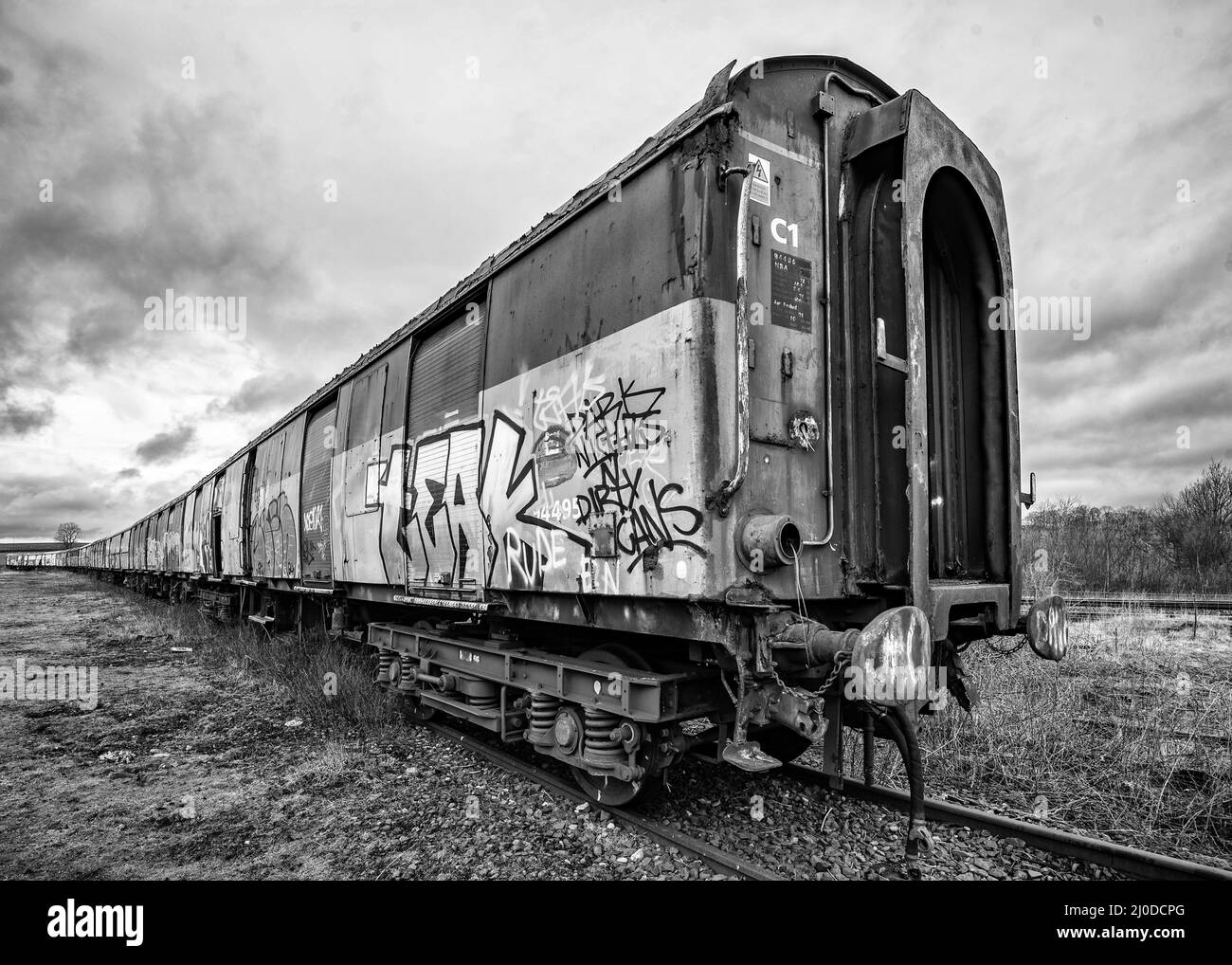 Spray painted train carriages Black and White Stock Photos & Images - Alamy