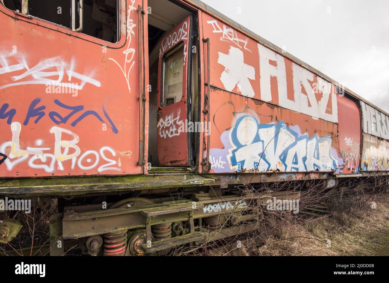 Graffiti vandals spray painted graffiti on abandoned railway carriages ...