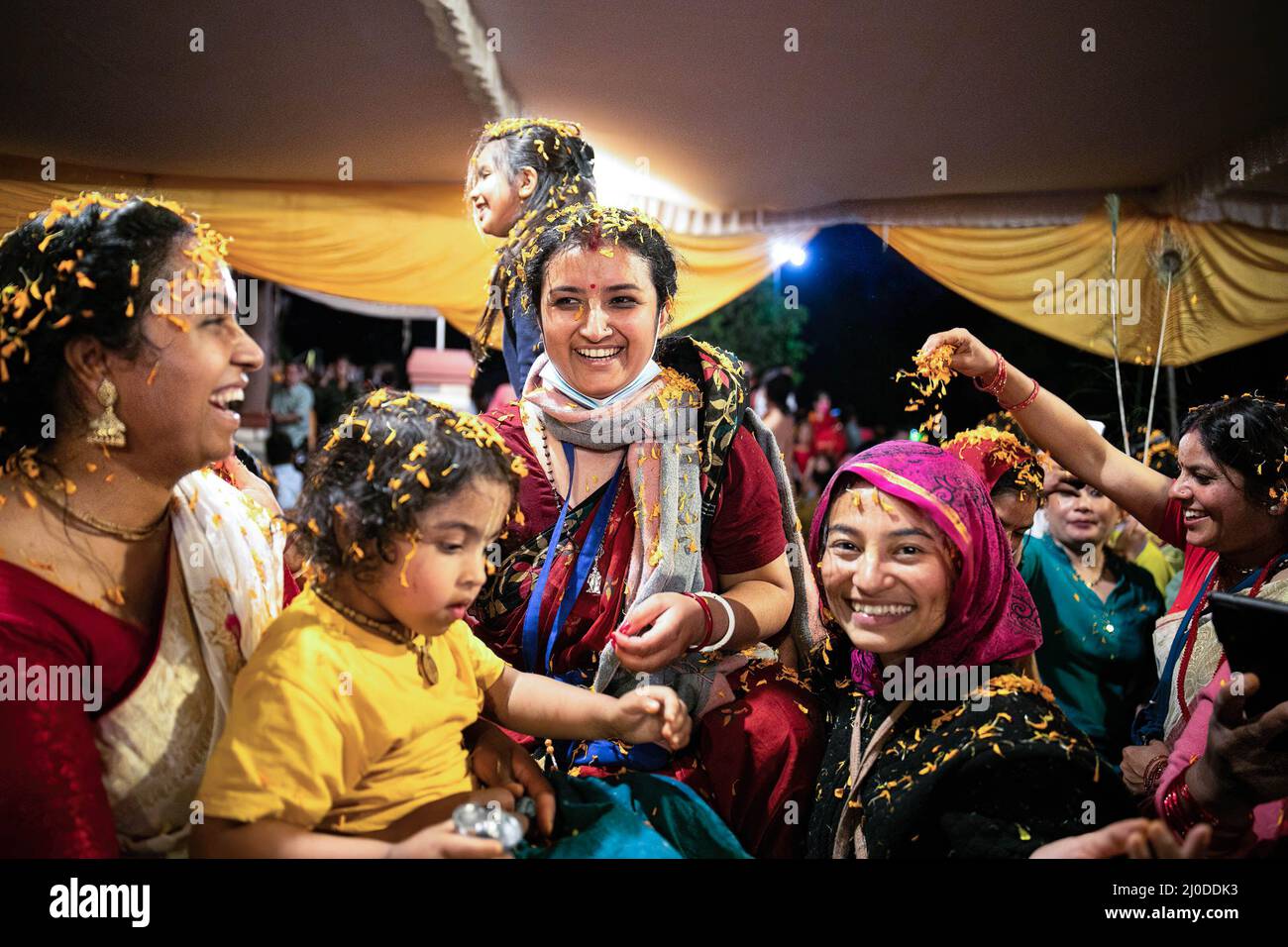 Kathmandu, Nepal. 18th Mar, 2022. Devotees sing and dance as flower ...