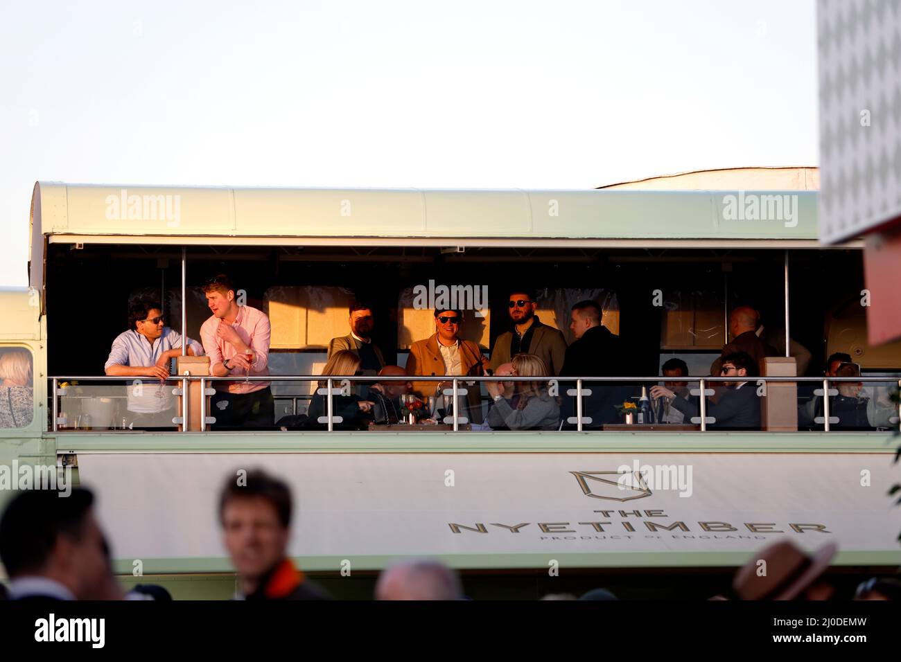 Racegoers enjoy refreshments in the Nyetimber bus in the Orchard at the ...