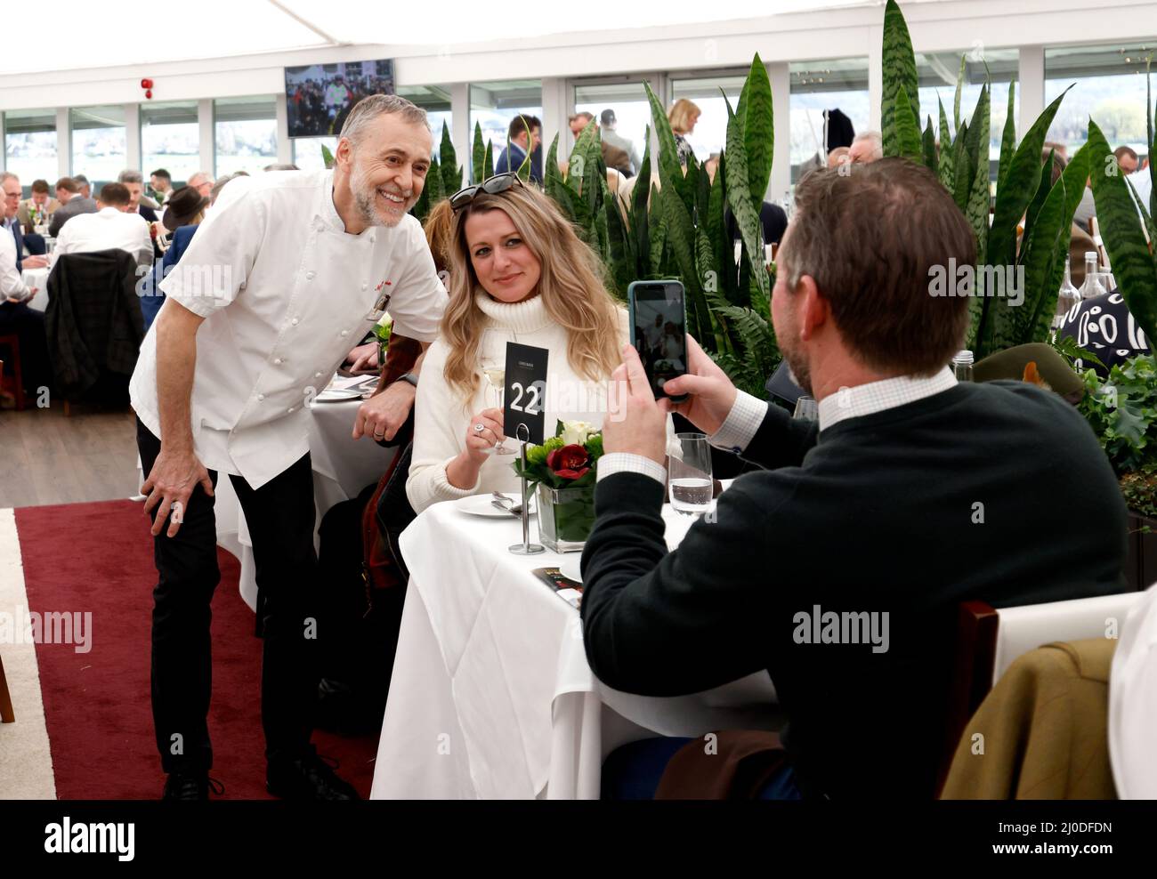 Michel Roux Jr. poses for a photo with a guest in the Chez Roux ...