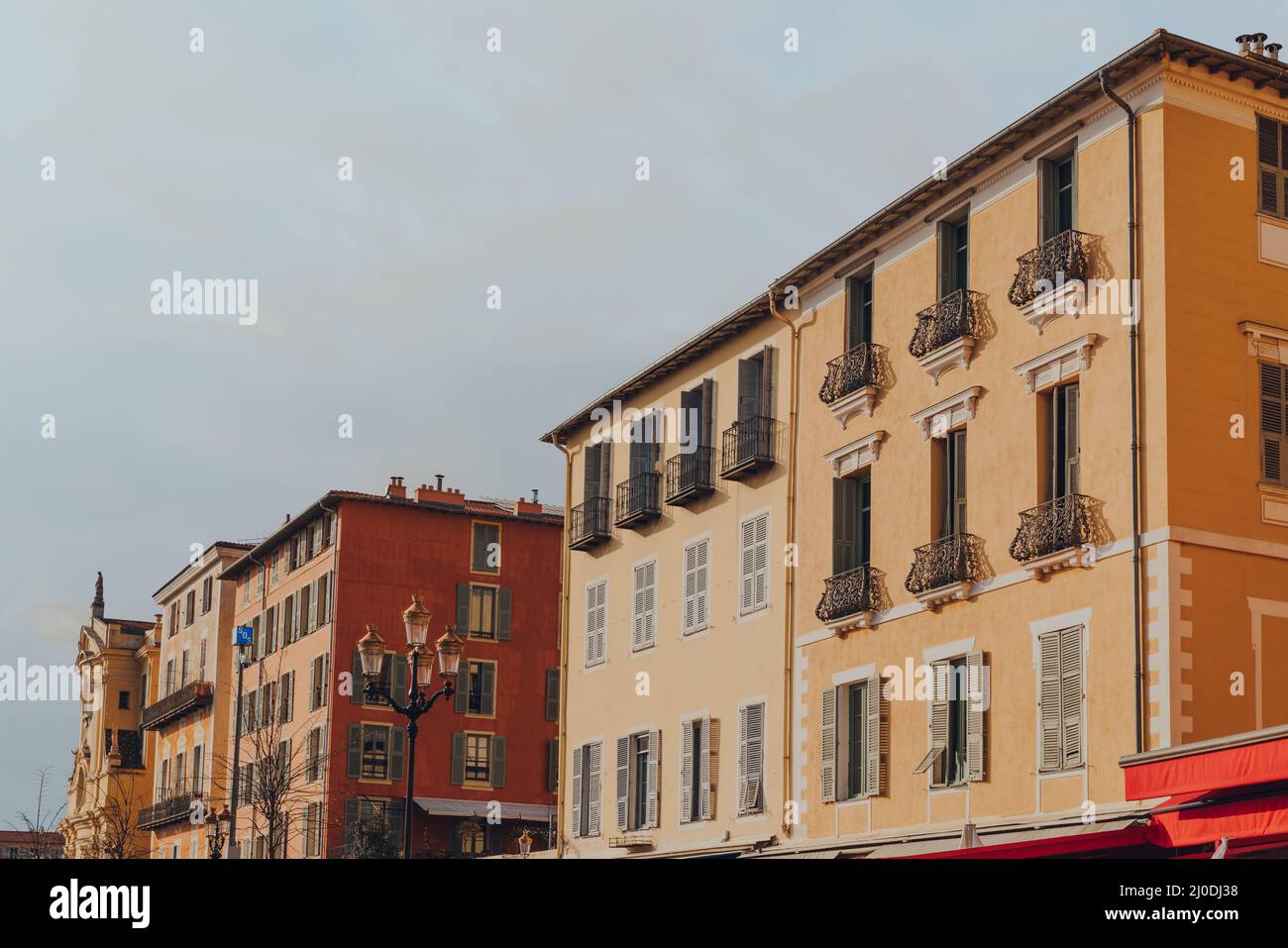 Row of traditional colourful buildings on Cours Saleya in the Old Town ...