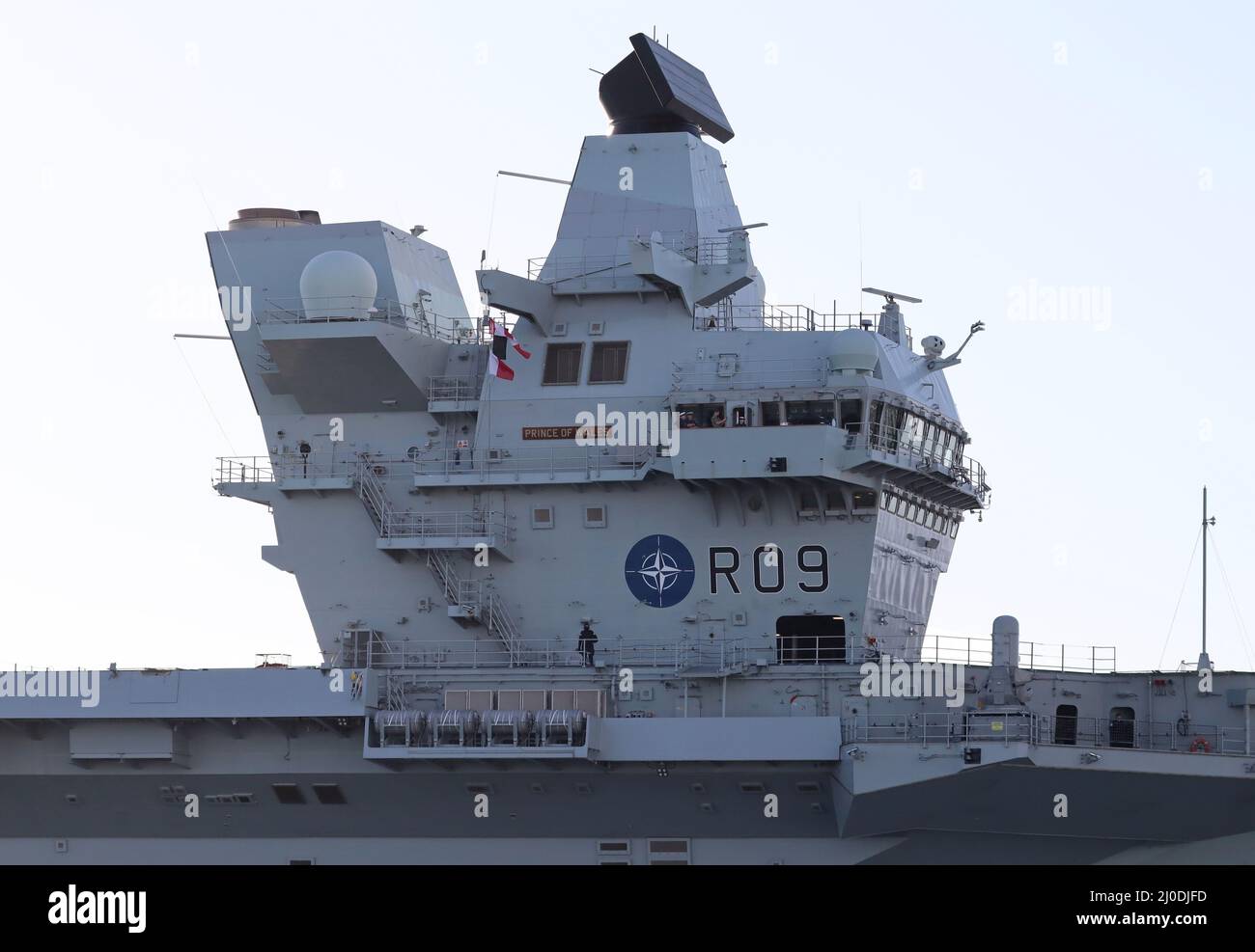 The Royal Navy aircraft carrier HMS PRINCE OF WALES with the NATO badge ...