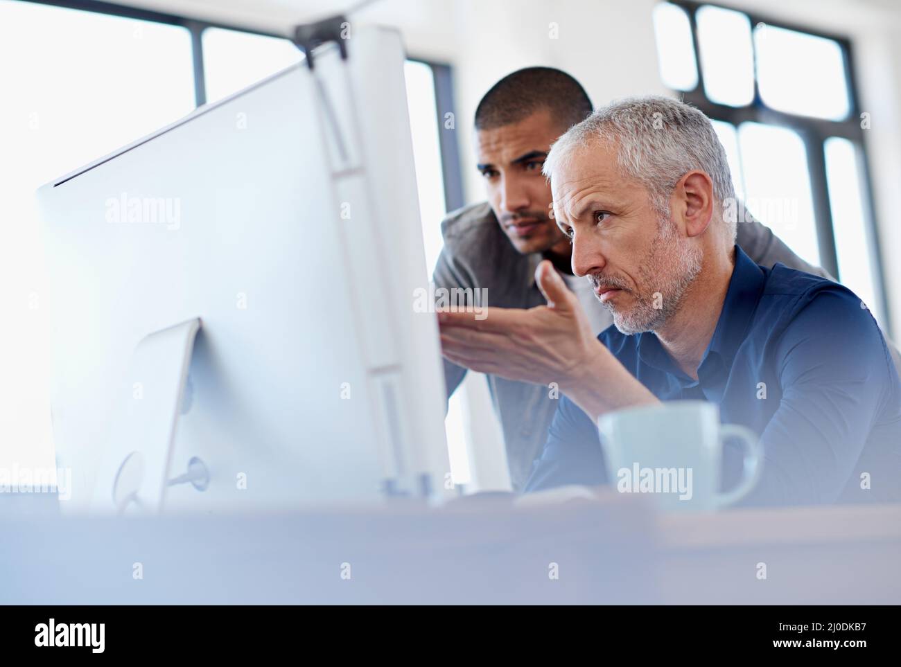 Giving some experienced advice. Shot of two colleagues having a ...