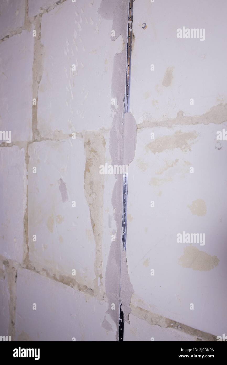 Electrical Cable laying on wall. Wiring replacement. Connecting light ...