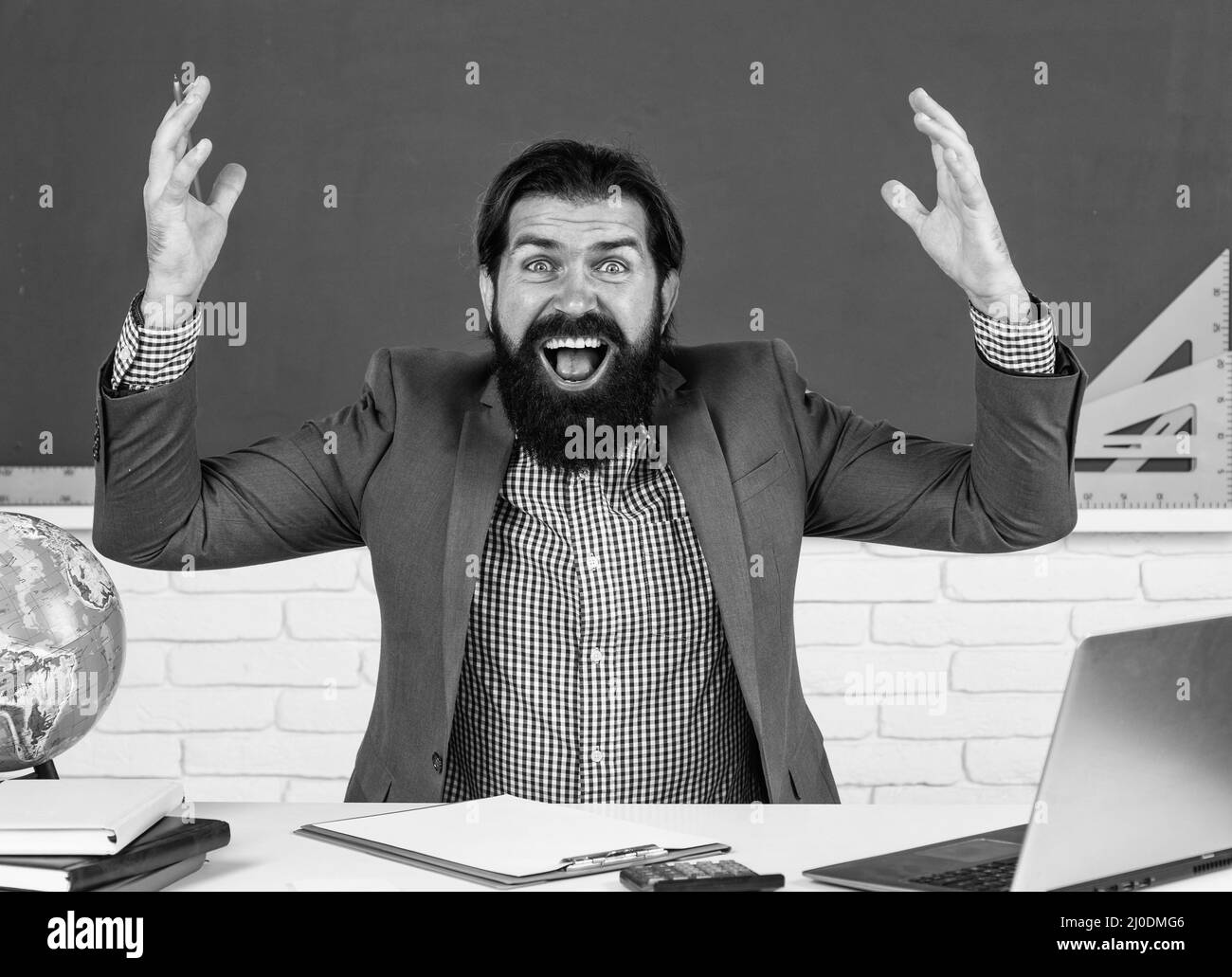 Teacher working laptop classroom Black and White Stock Photos & Images ...