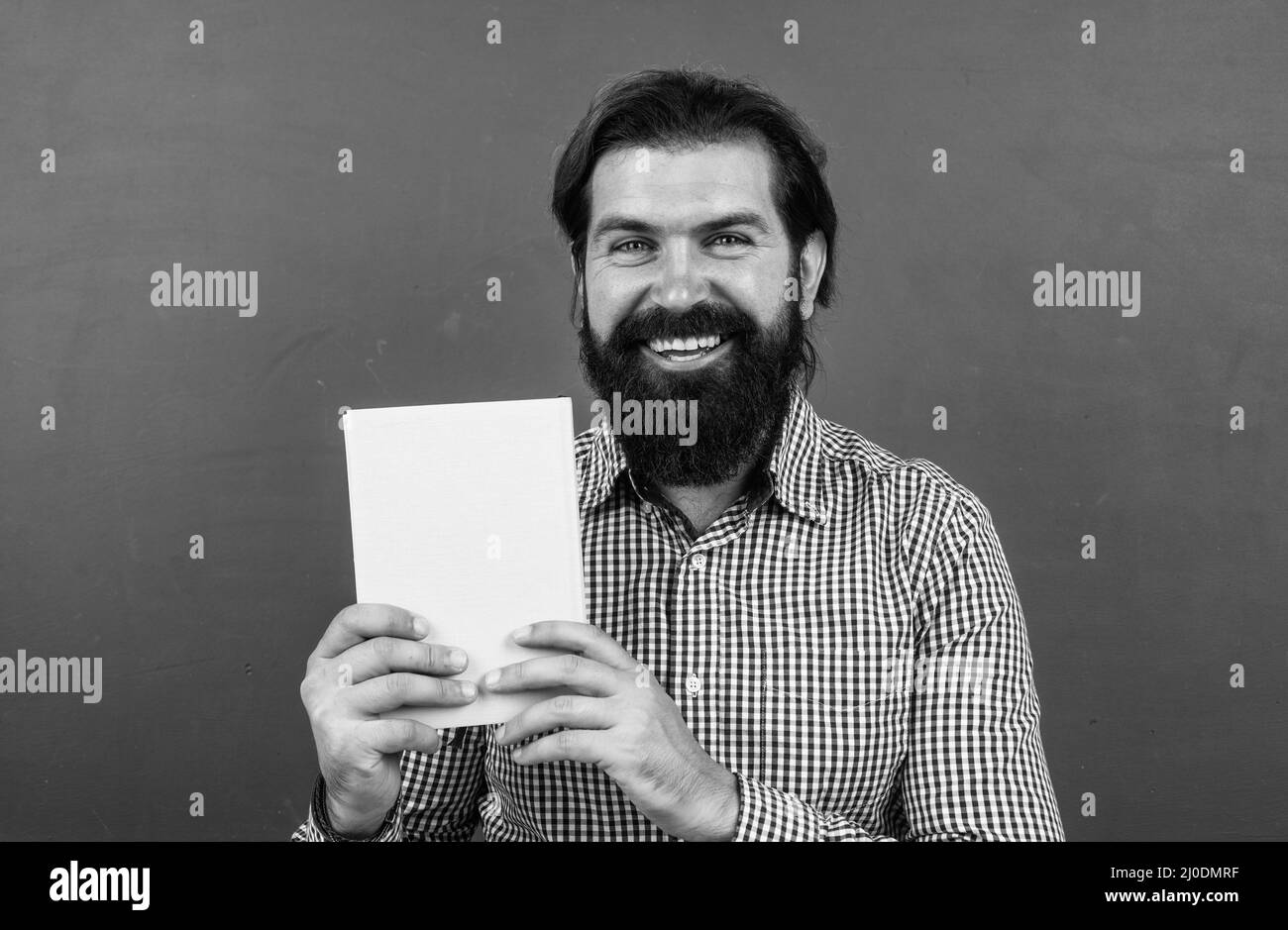 best book ever. learning the subject. happy man with beard showing the ...