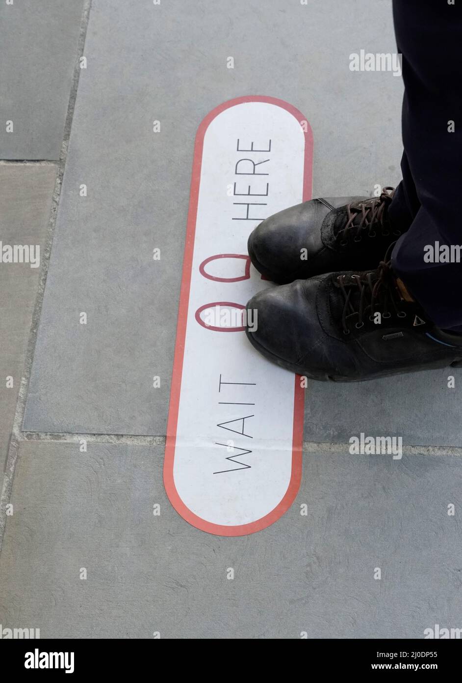 Wait here instruction Stock Photo - Alamy