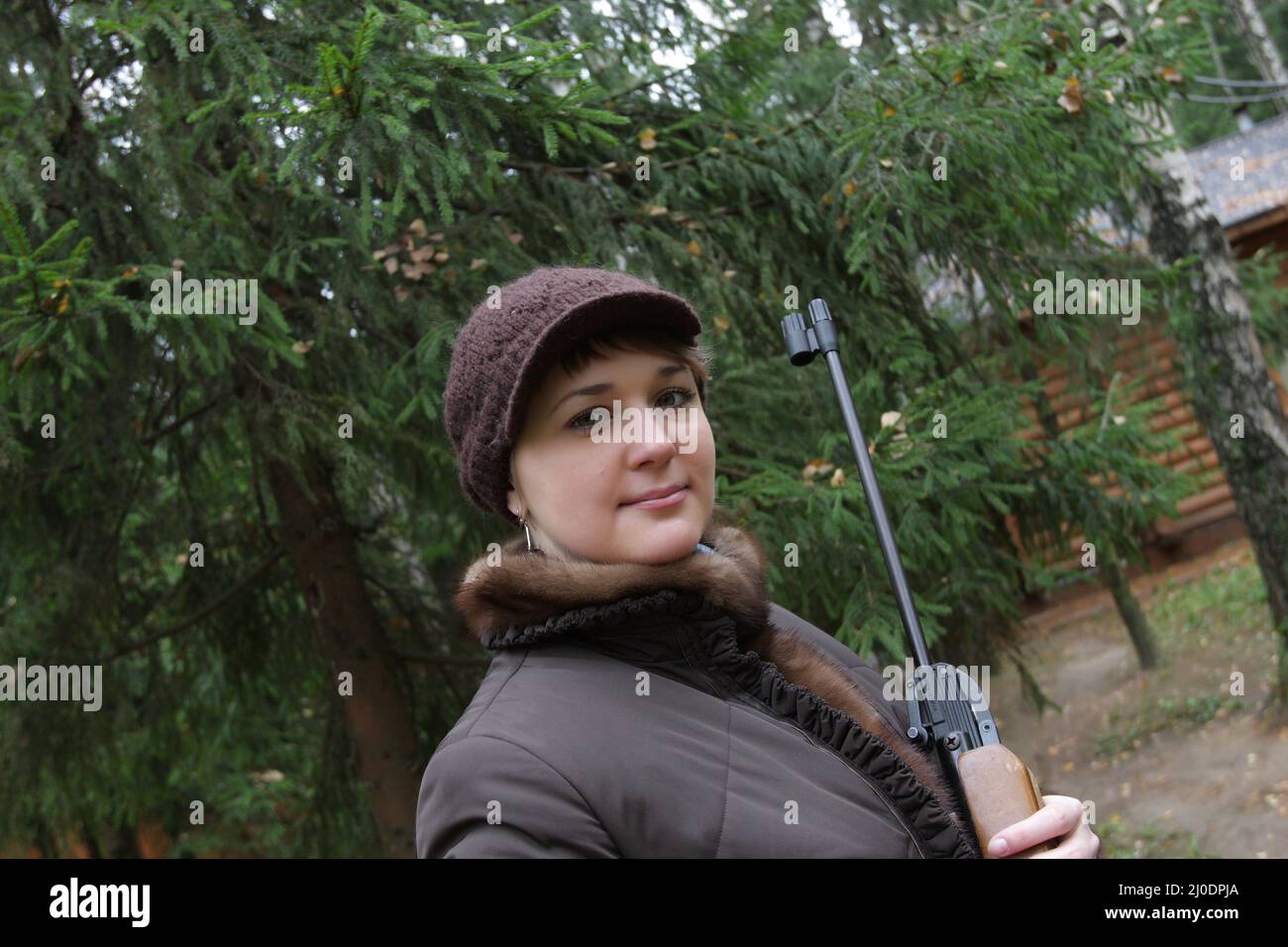 The girl with a pneumatic air rifle Stock Photo - Alamy