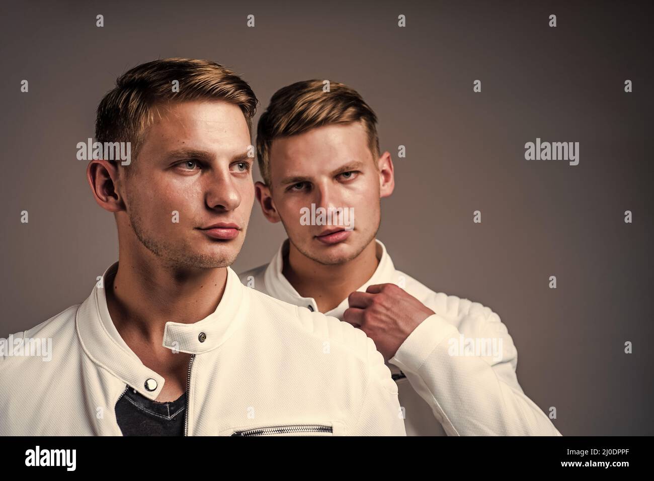 twins brother in white. male beauty and fashion. similar appearance ...