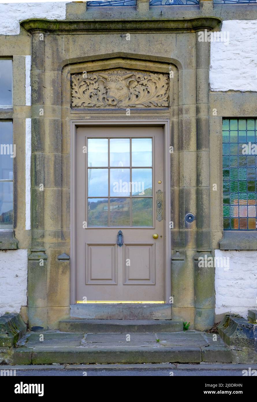 An old stone carving of a bull's head, originally taken from a ...