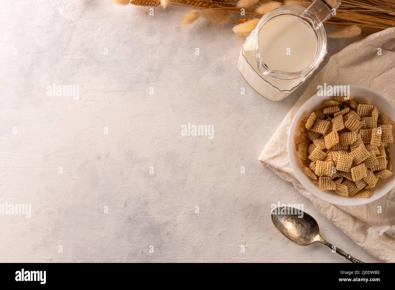 Whole grain breakfast - crispy cereal in a bowl, milk in a jug and a ...